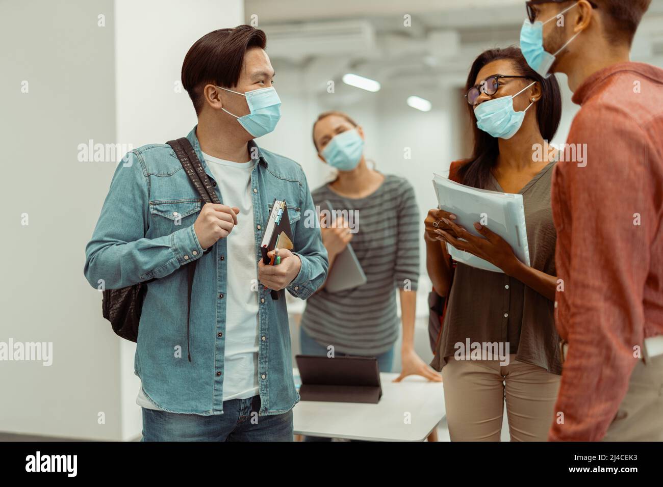 Diverse group of students wearing mask hi-res stock photography and ...