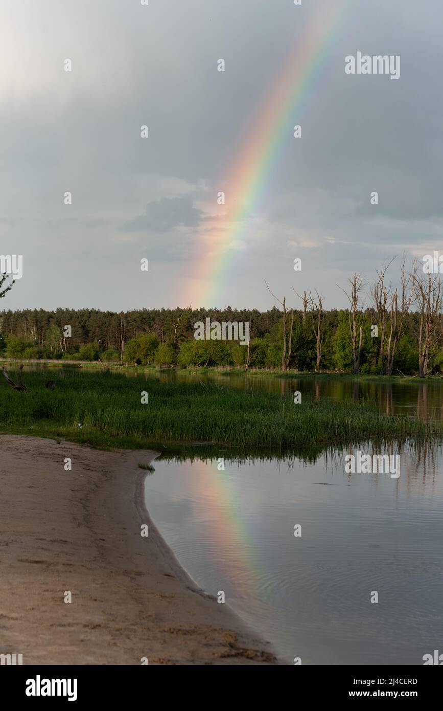 Rainbow reflecting in the river. Spring landscape by the water Stock ...