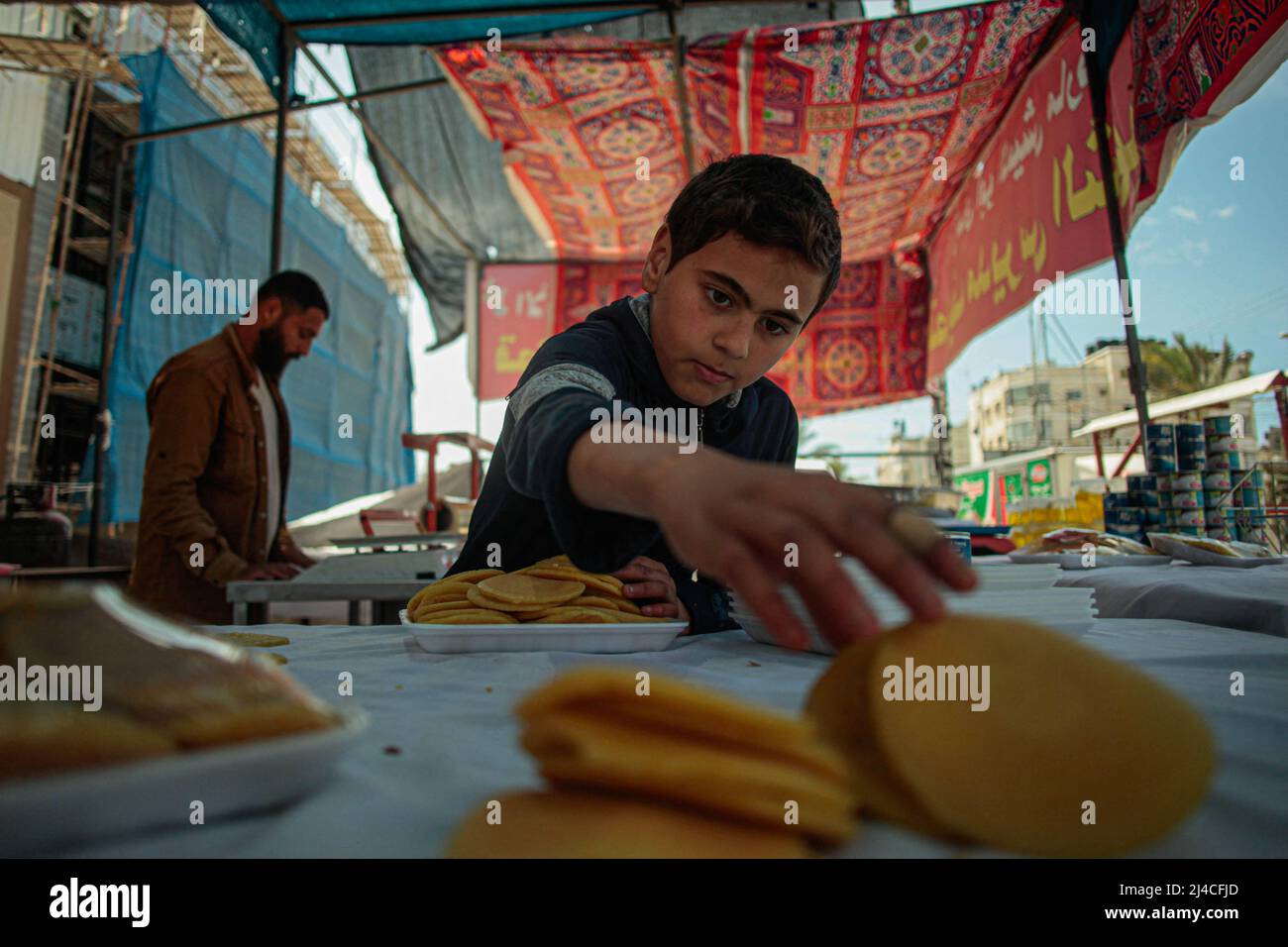 Palestinian sweets vendor equips "Qatayef" sweets during the holy month ...