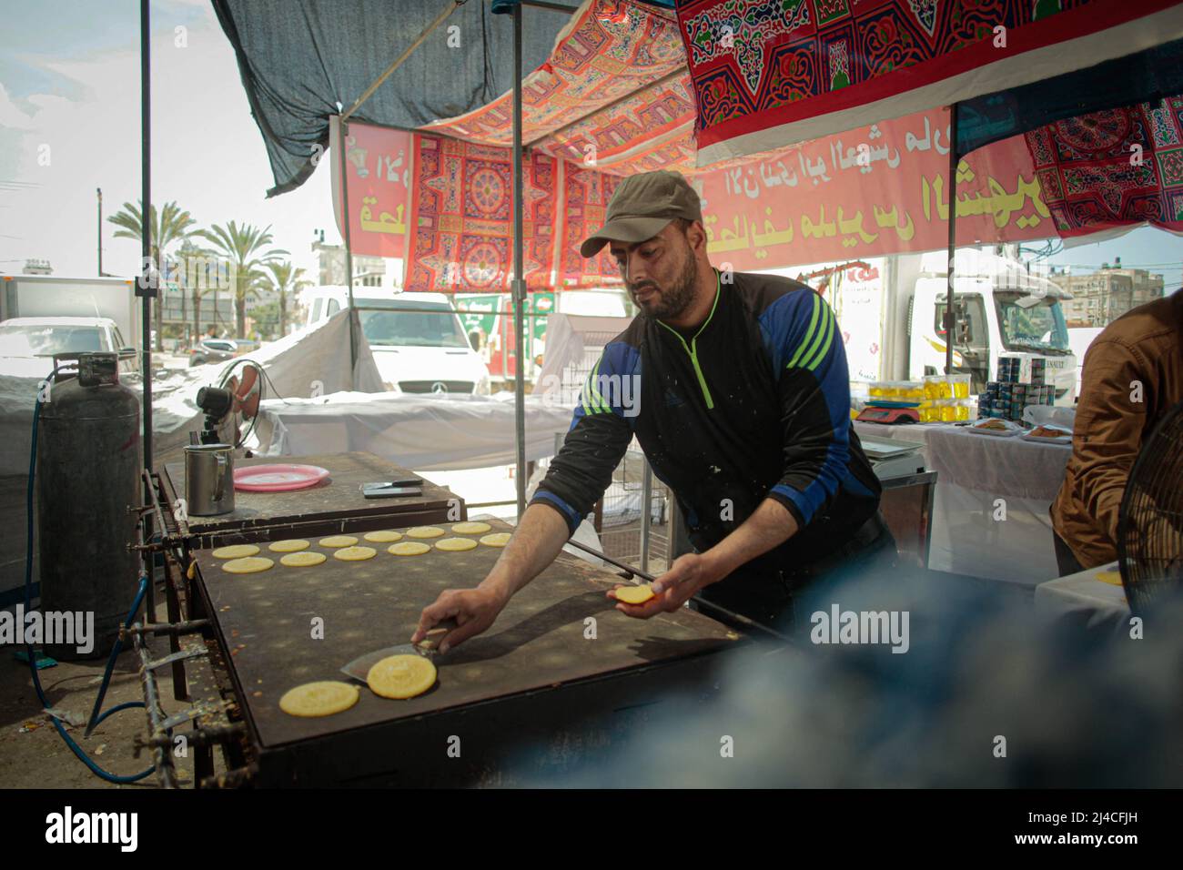 Palestinian sweets vendor equips "Qatayef" sweets during the holy month ...