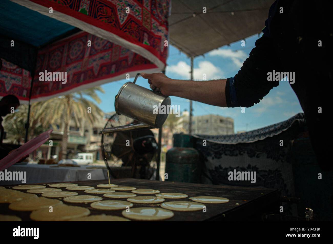 Palestinian sweets vendor equips "Qatayef" sweets during the holy month ...
