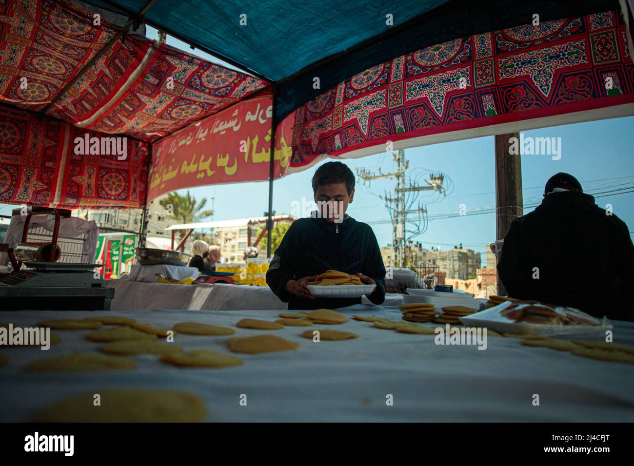 Palestinian sweets vendor equips "Qatayef" sweets during the holy month ...