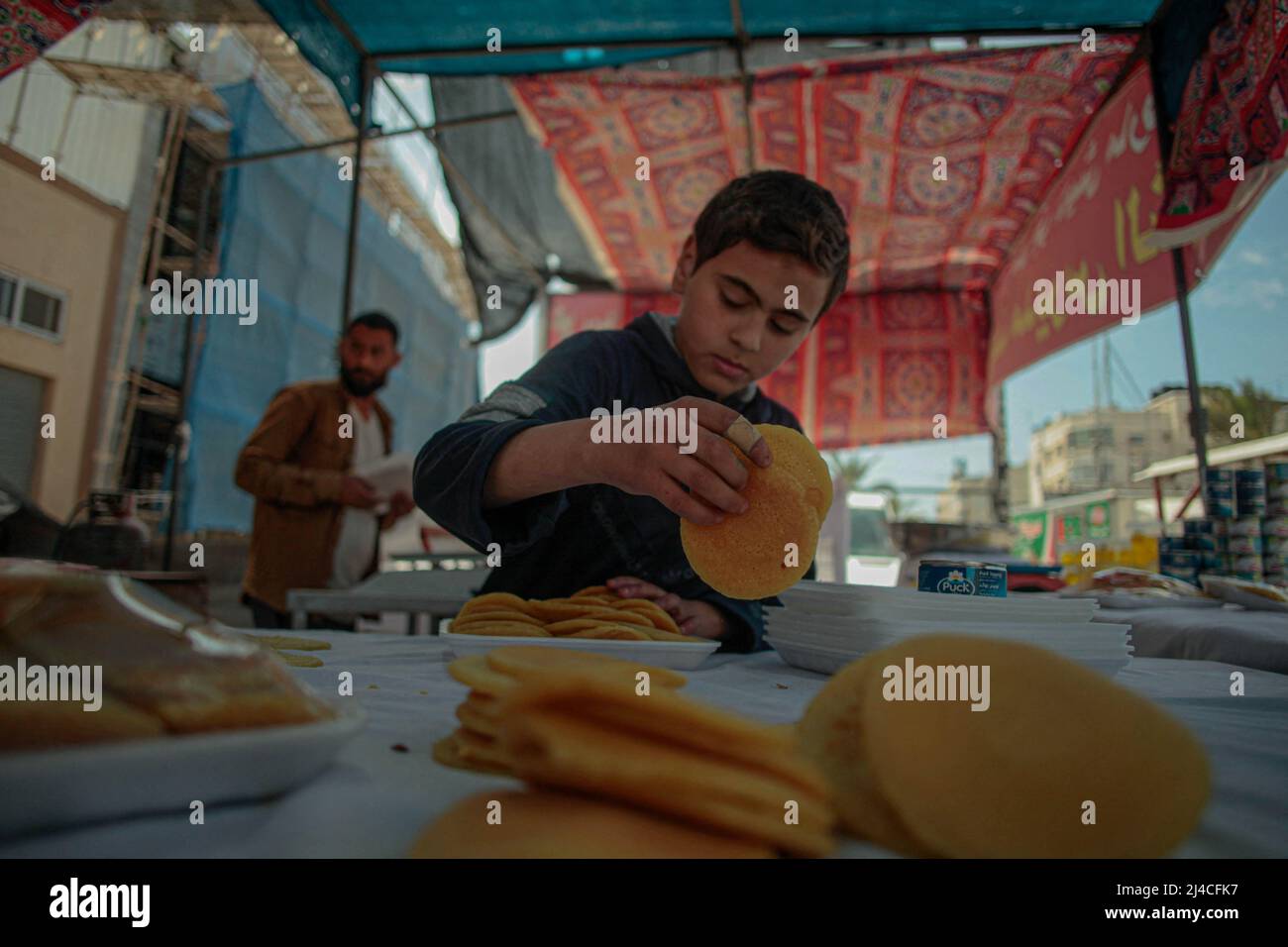 Palestinian sweets vendor equips "Qatayef" sweets during the holy month ...