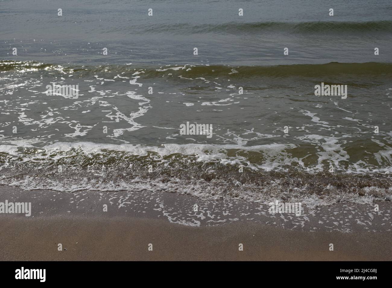 Beautiful landscape - turquoise colored sea water, sand, sky. The waves ...