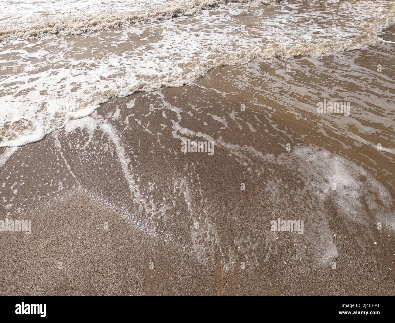 Sea serf of the Sea of Azov, the clay coast on a sunny day in summer ...