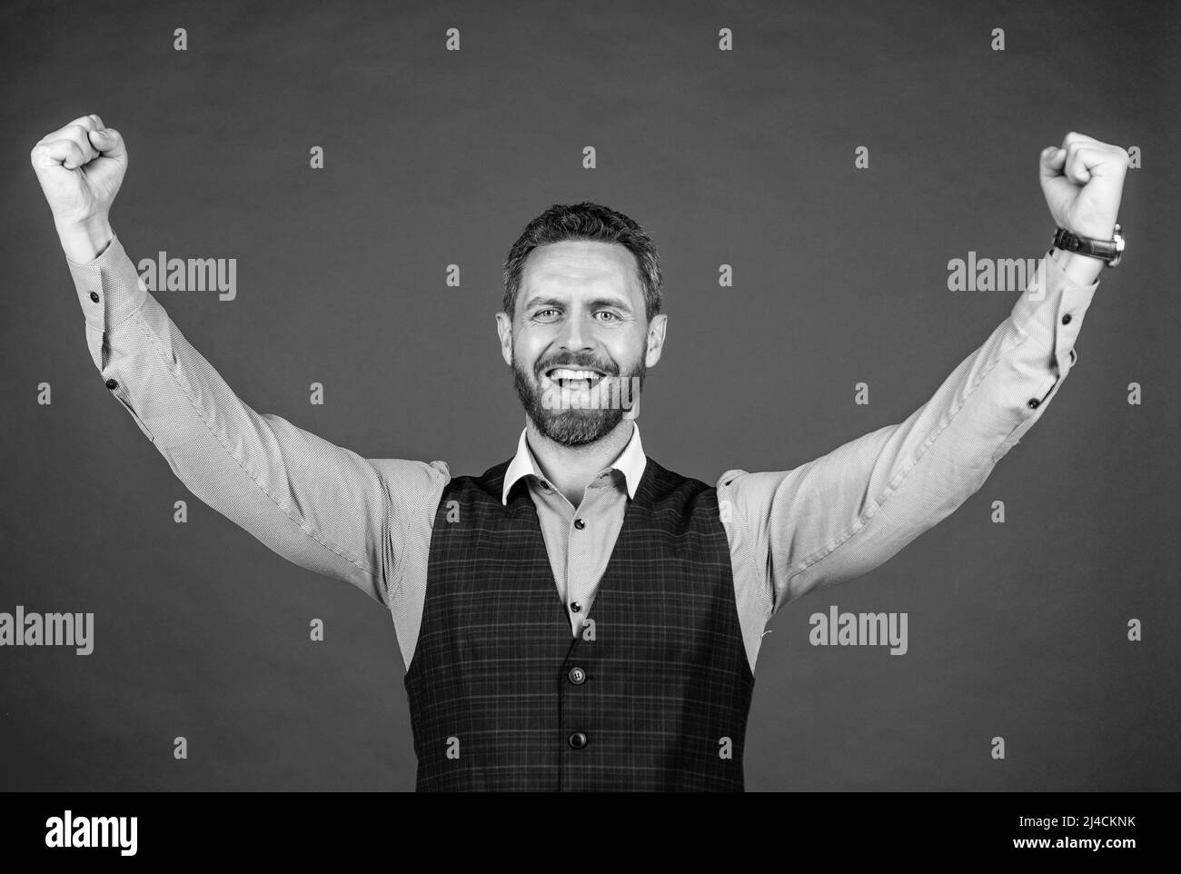 mature smiling guy in suit celebrating success, yes Stock Photo - Alamy