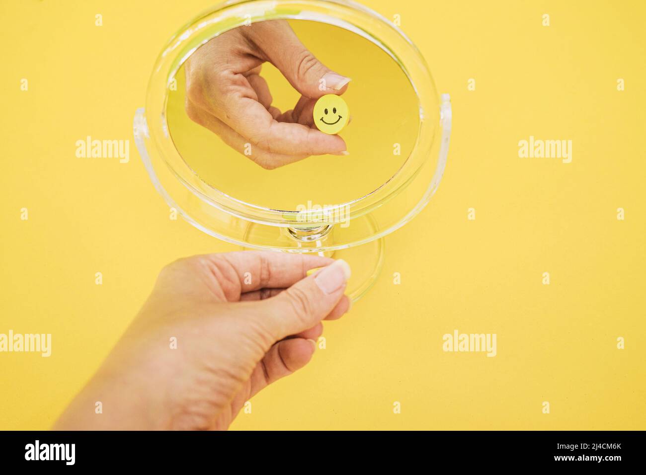 Conceptual image of happiness and wellness of a smiley face reflected ...