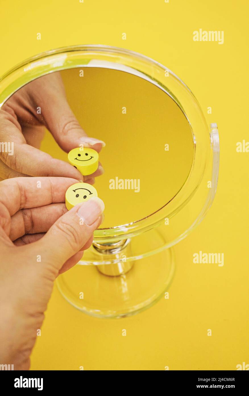 Conceptual image of happiness and wellness of a smiley face reflected ...