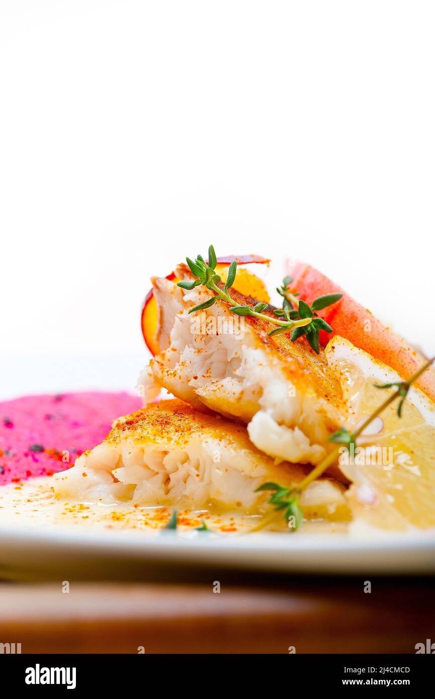 Sea bream orata fillet butter pan fried with fresh peach prune and ...