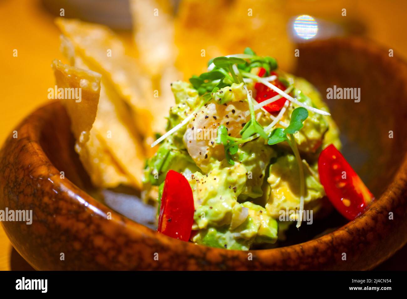 Fresh avocado and shrimps salad with nachos on side Stock Photo - Alamy