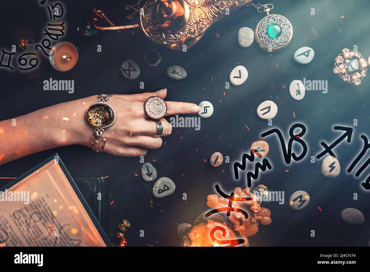 Astrology and esotericism. The witch's female hands point to the ...