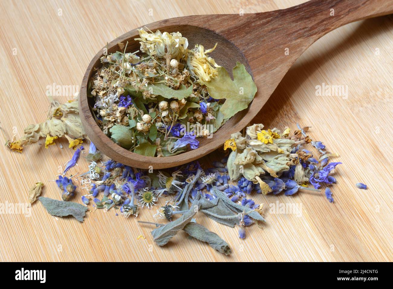 Tea mixture in wooden ladle and medicinal plants, tea mixture Stock ...