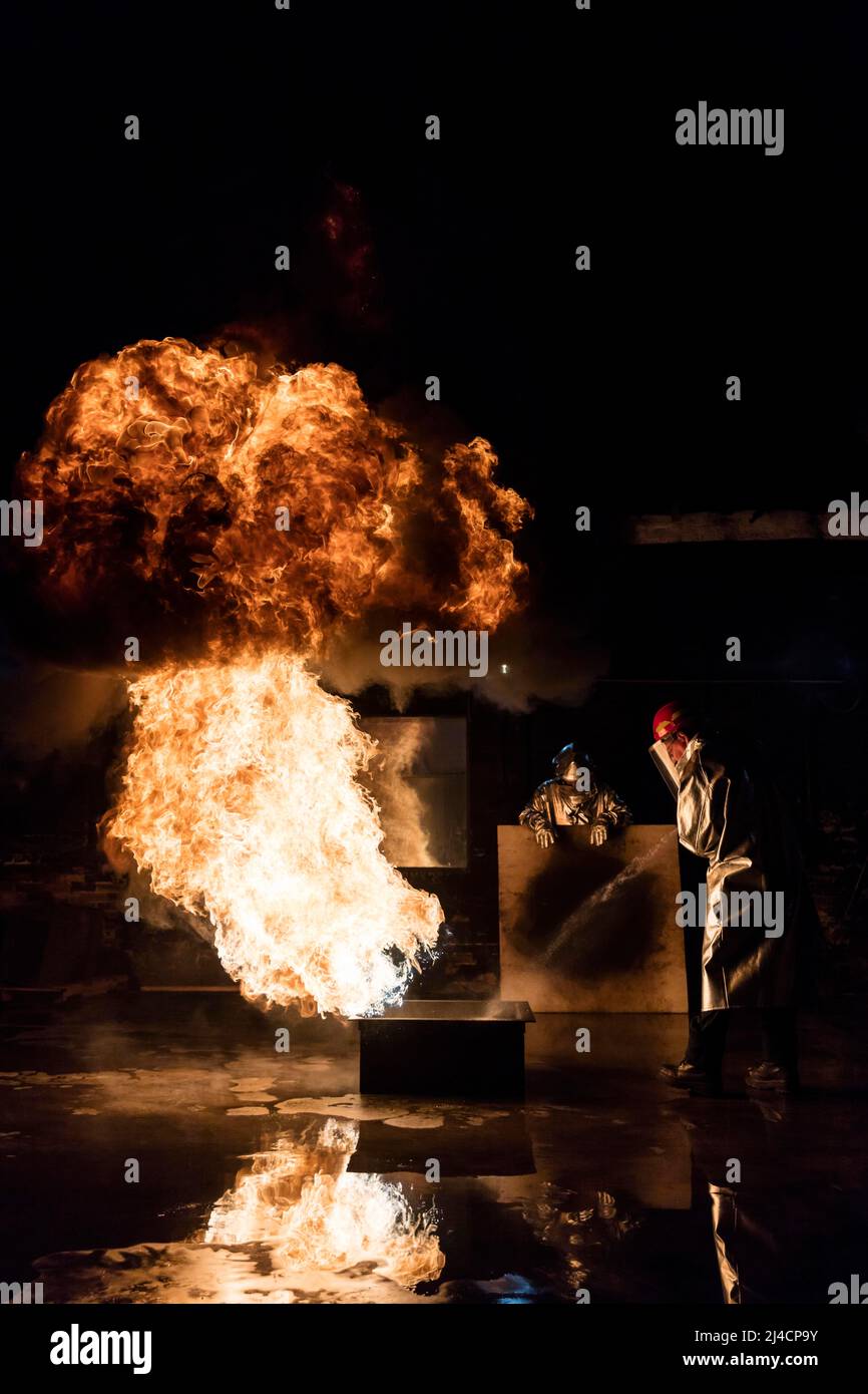 Firefighter extinguishes a heptane 2B-Pan fire with a 2-BTP ...