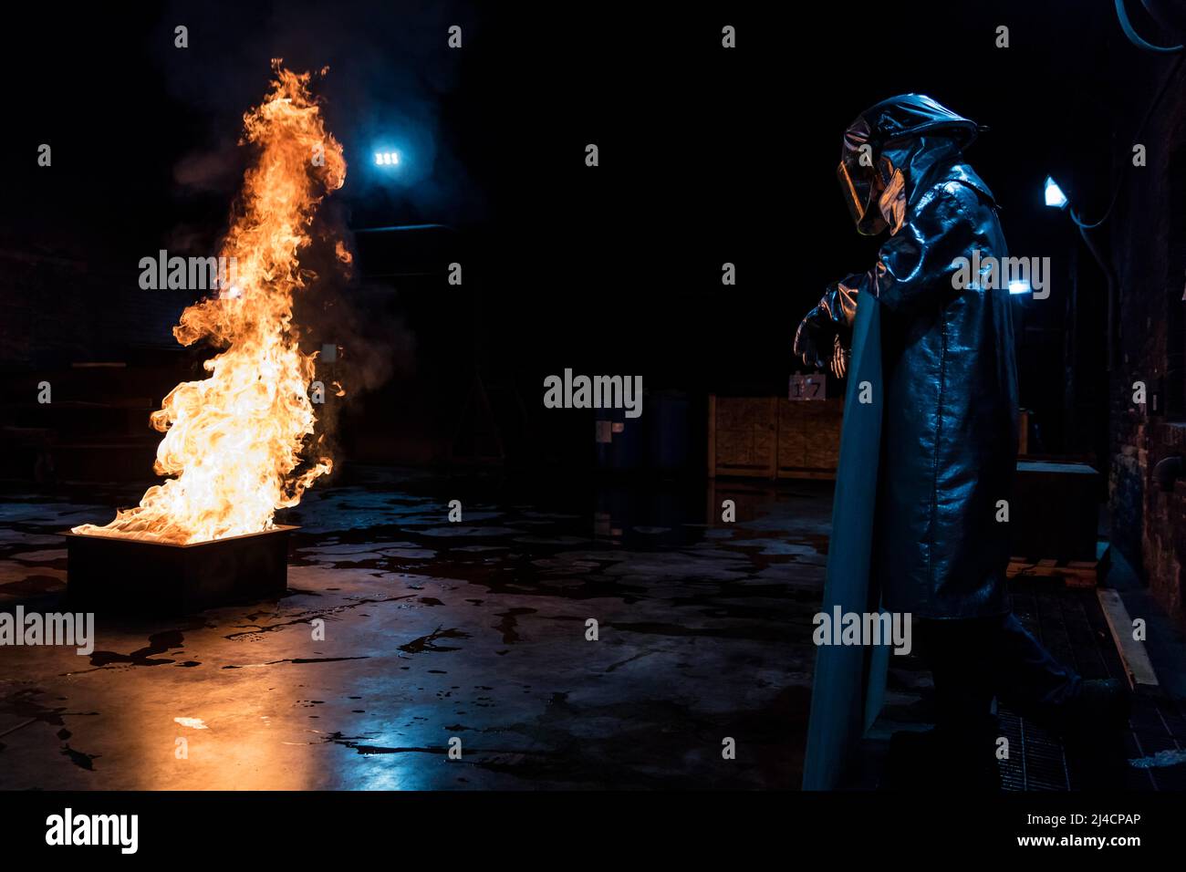 Firefighter in front of a burning Heptane 2B-Pan fire, Illinois ...