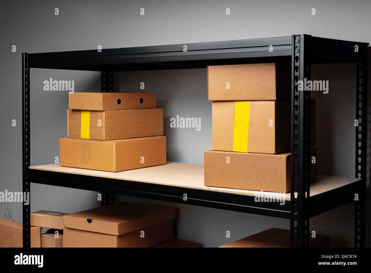Rack shelves with paper boxes in warehouse Stock Photo - Alamy