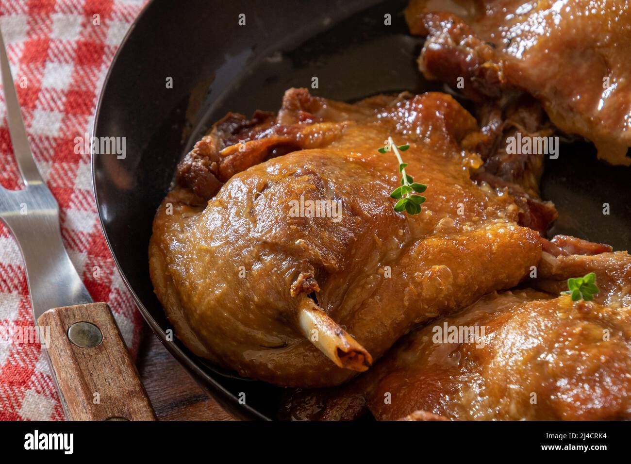 duck confit cooked in a dish Stock Photo - Alamy