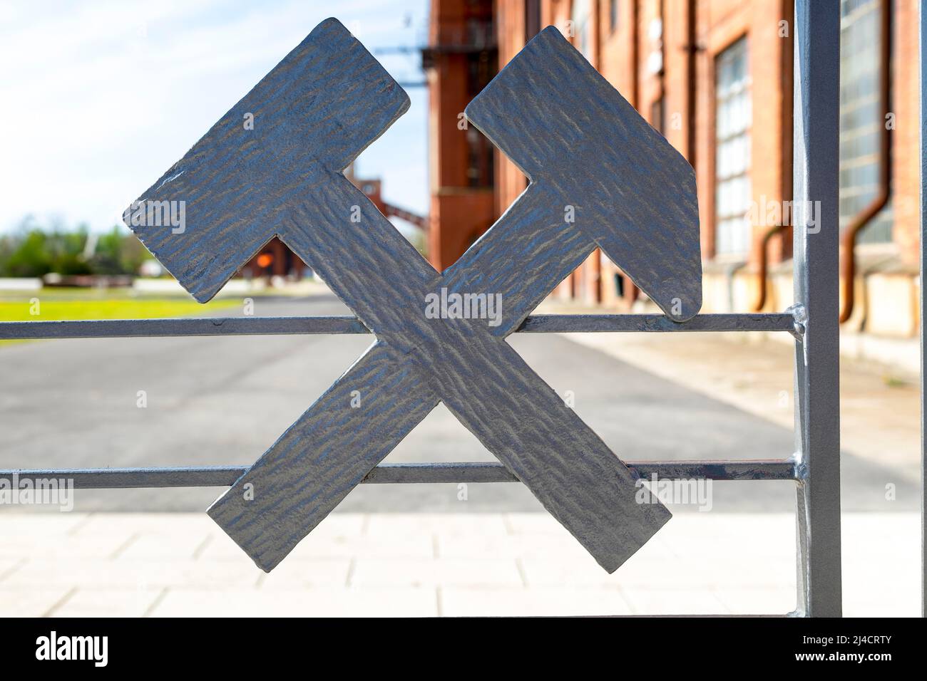 Mallet and iron, metal mining symbol on a fence, Knappenrode energy ...
