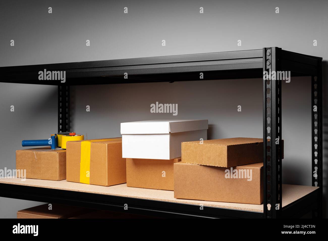 Rack shelves with paper boxes in warehouse Stock Photo - Alamy