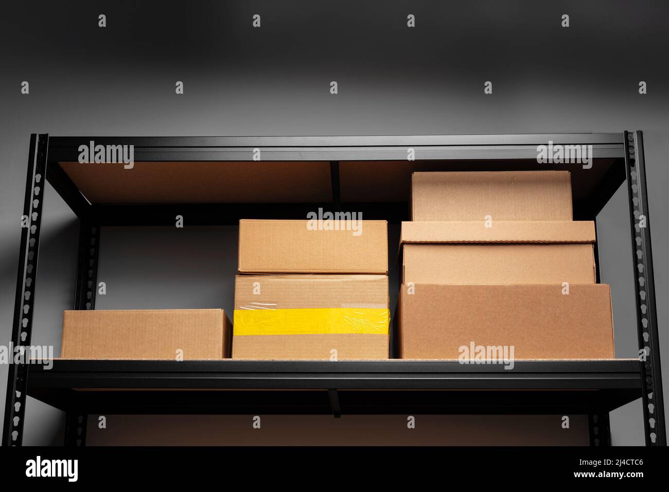 Rack shelves with paper boxes in warehouse Stock Photo - Alamy