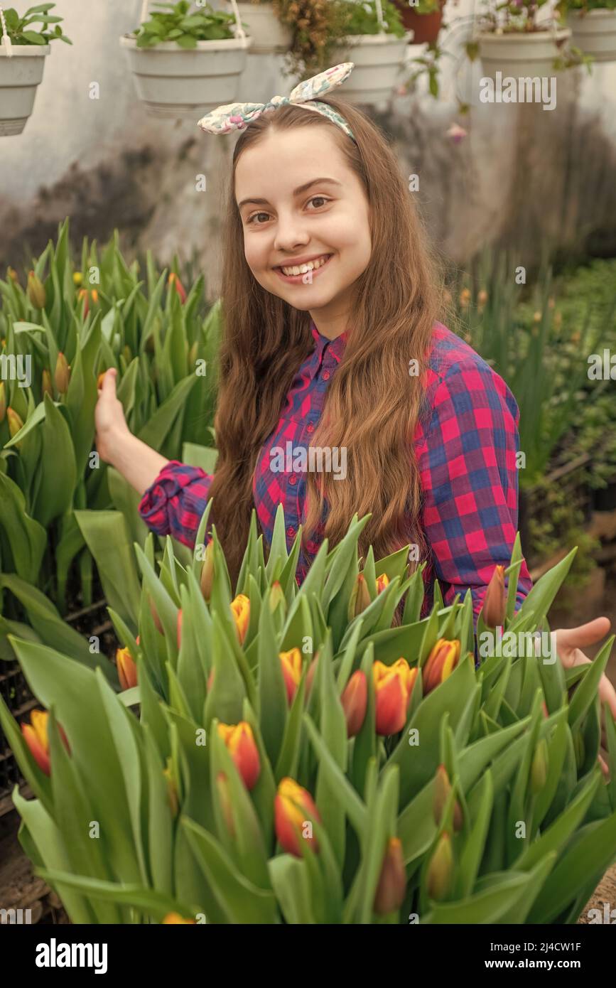 Teen girl plant in greenhouse hi-res stock photography and images - Alamy
