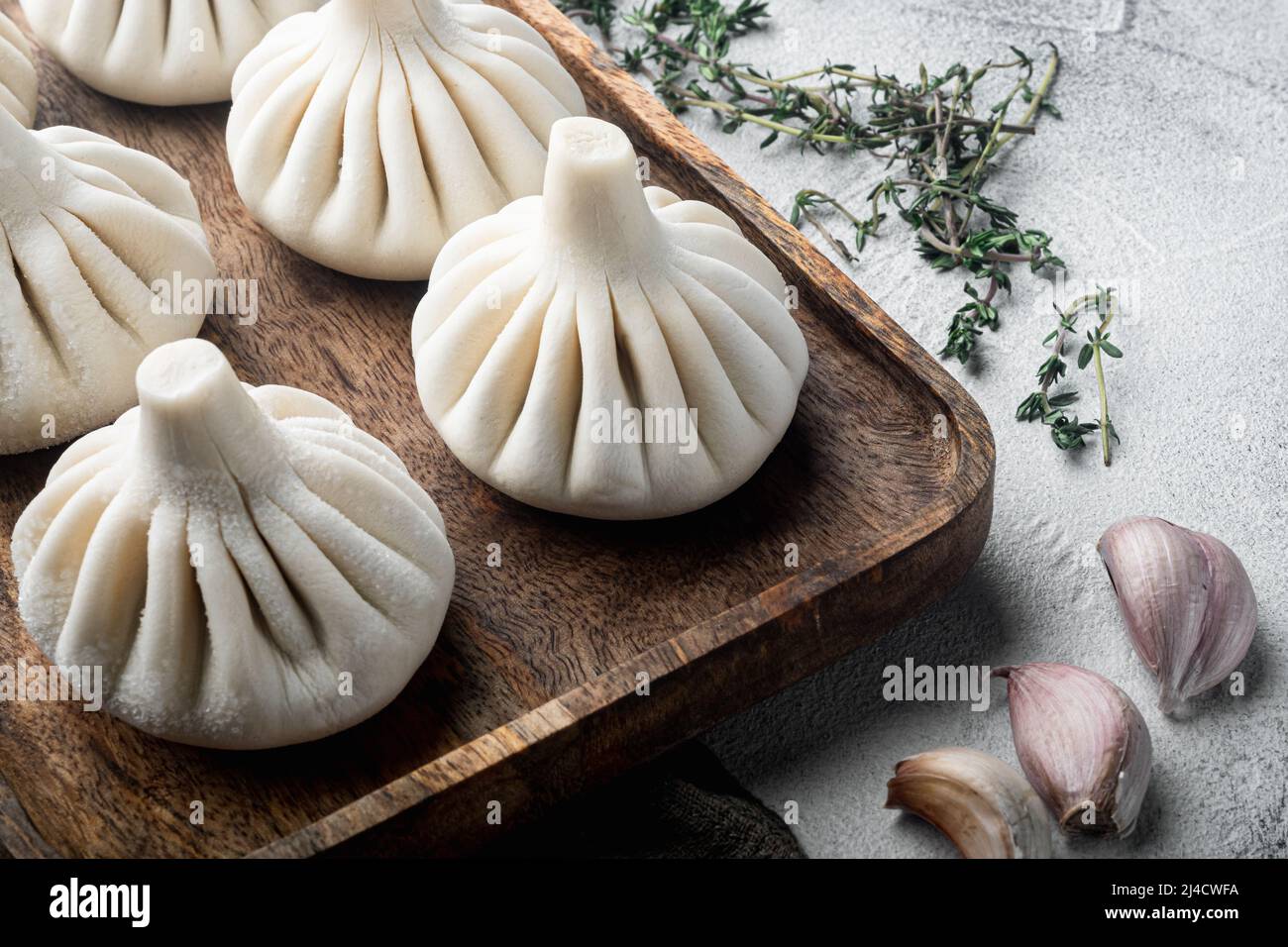 Frozen Raw dumplings Khinkali with beef and lamb meat set, on gray ...
