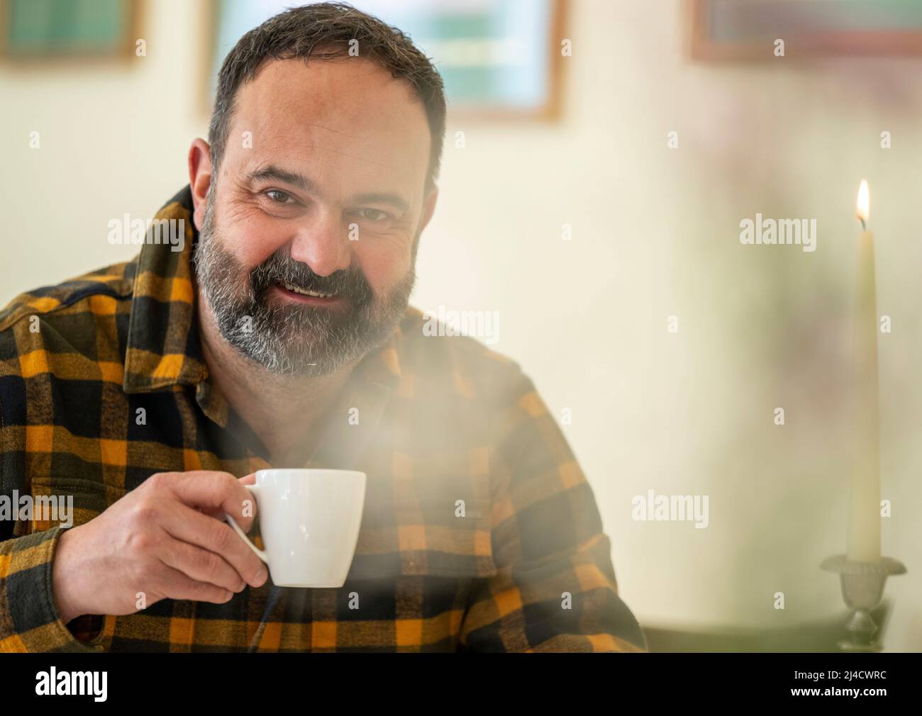 Berlin, Germany. 11th Apr, 2022. Actor Tom Keune drinks a coffee in a ...