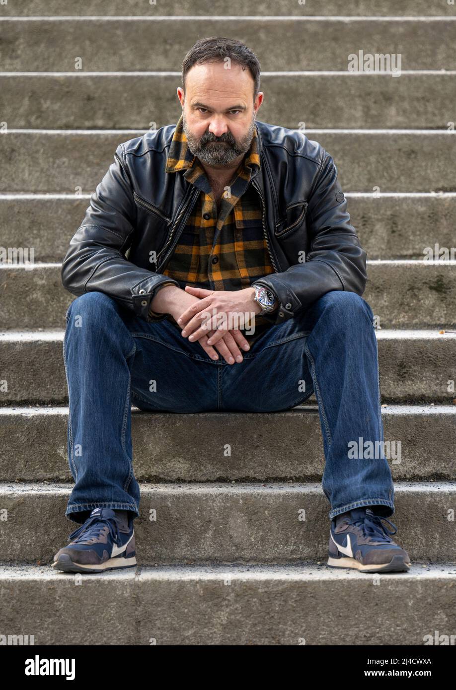 Berlin, Germany. 11th Apr, 2022. Actor Tom Keune sits on a staircase in ...