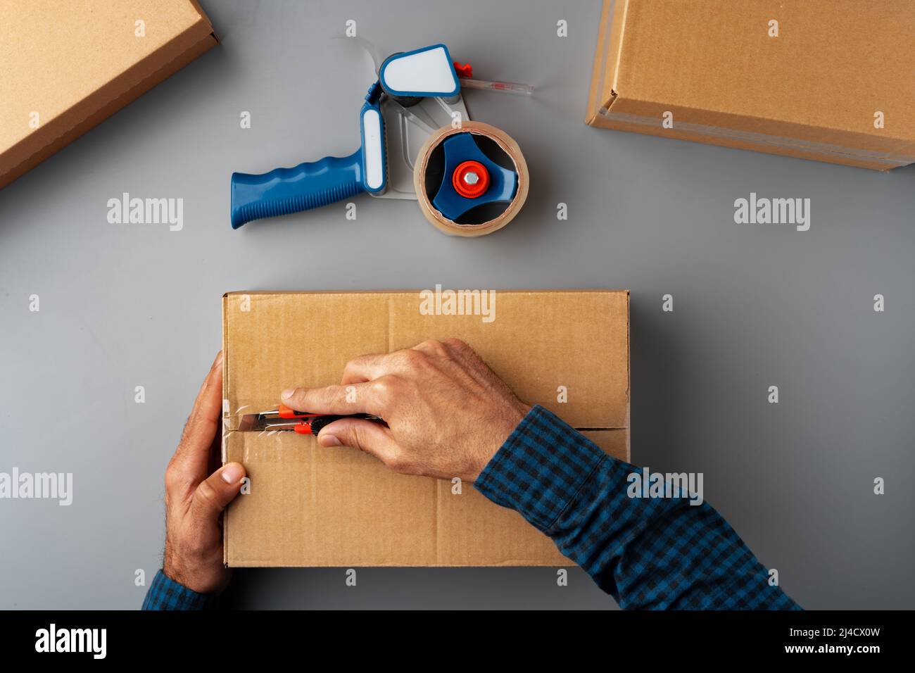 Above table top view of warehouse preparing post courier delivery ...