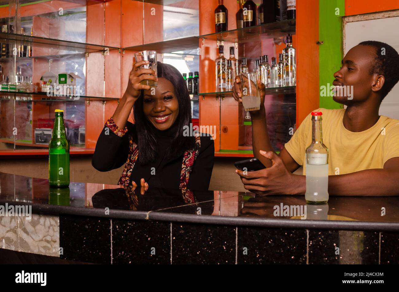 beautiful couple having a toast of drink in the bar, pub Stock Photo ...