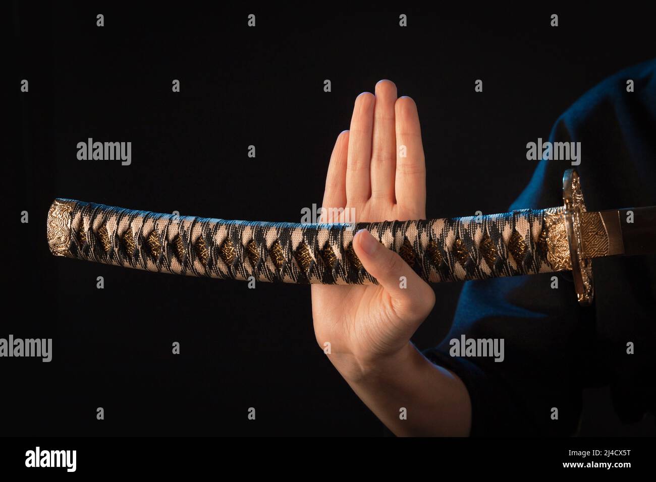 Hand holding sword hilt hi-res stock photography and images - Alamy