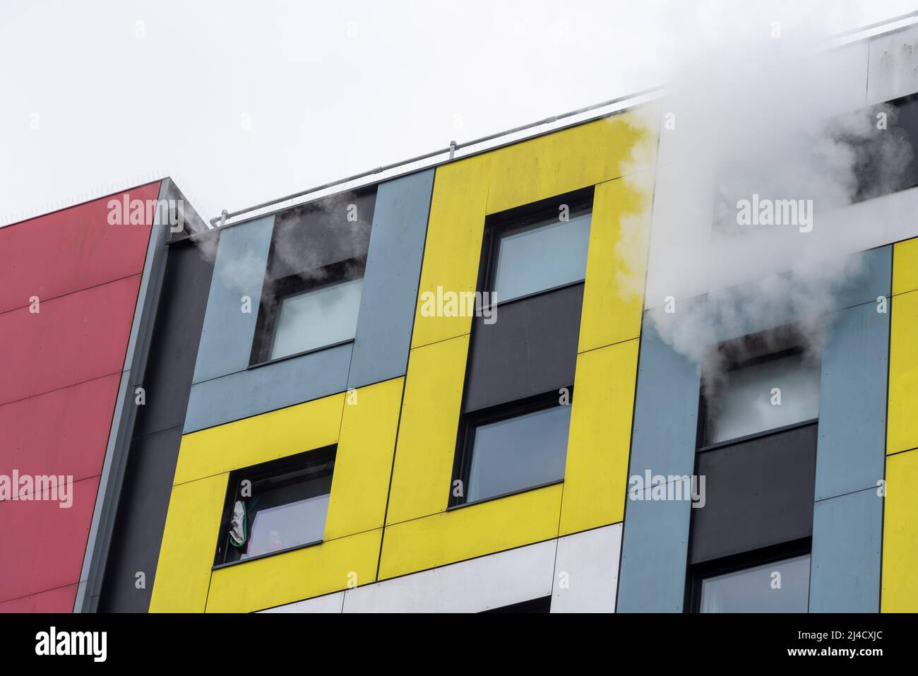Controlled smoke from the top floors of cladding covered university ...