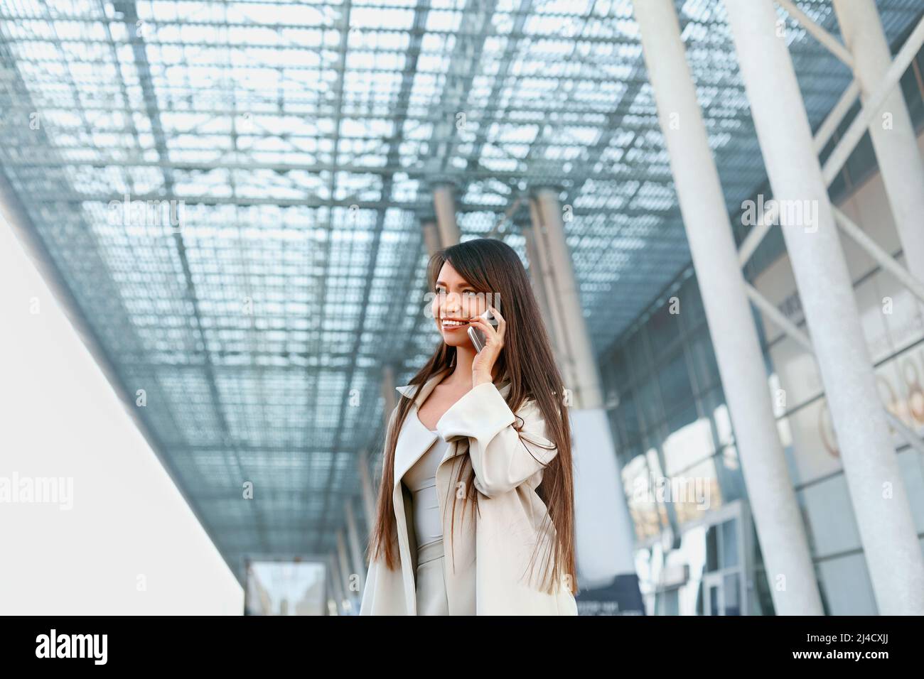 Woman Calling on Phone Standing . Portrait of Beautiful Smiling Female ...