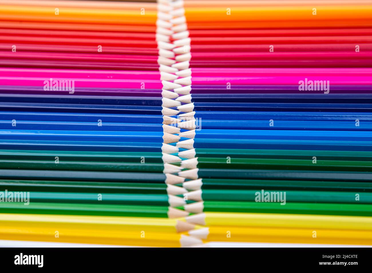 Background of triangular colored pencils Stock Photo - Alamy