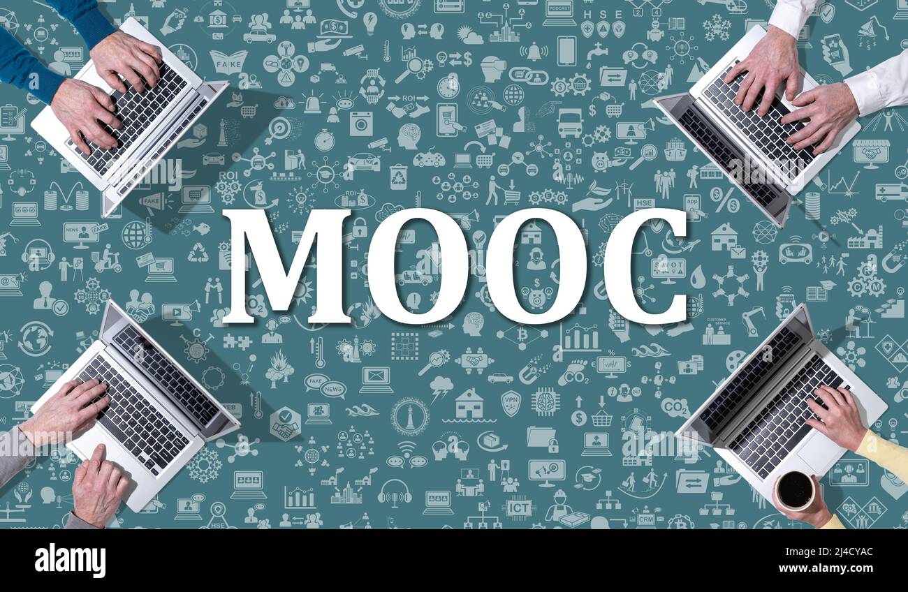 Mooc concept with top view of hands using laptop on icons background Stock Photo - Alamy