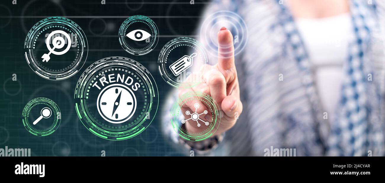 Woman touching a trends concept on a touch screen with her finger Stock ...