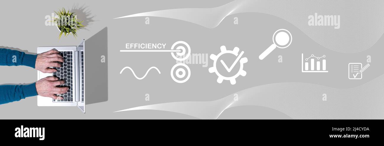 Top view of hands using laptop with symbol of efficiency concept Stock ...