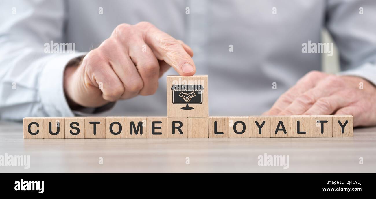 Wooden blocks with symbol of customer loyalty concept Stock Photo - Alamy