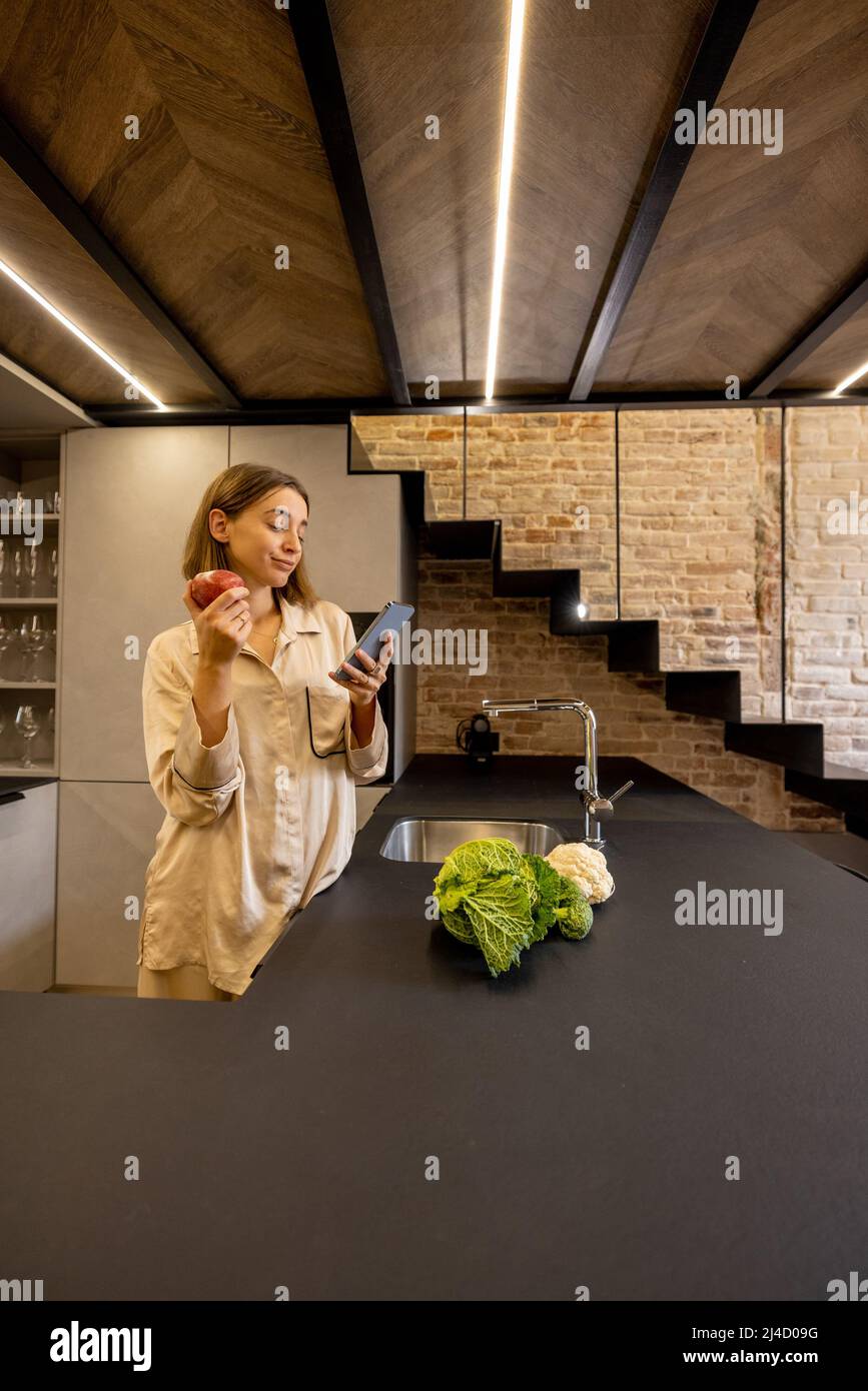 Woman cooking healthy at modern kitchen Stock Photo - Alamy