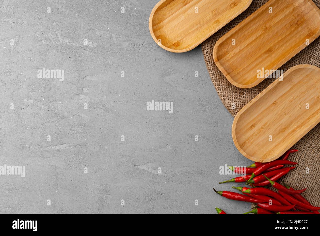 Empty wooden plate on kitchen table, top view Stock Photo - Alamy