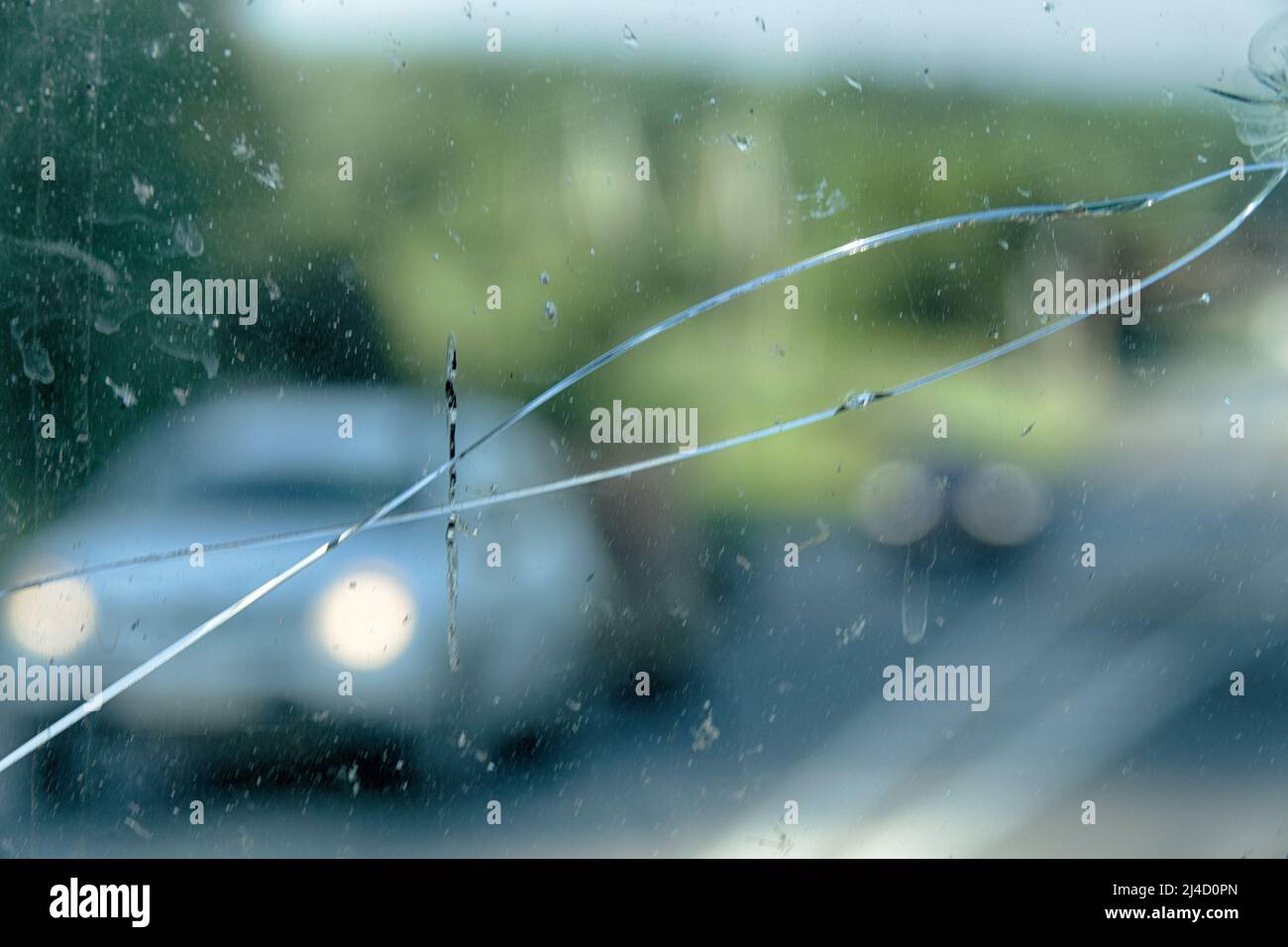 Highway through a broken windshield after encountering a truck with ...