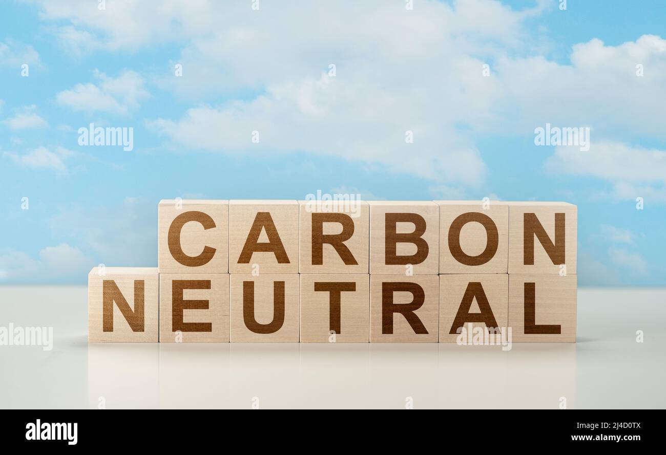 carbon neutral. text wooden cubes neutral carbon laid out on a white ...