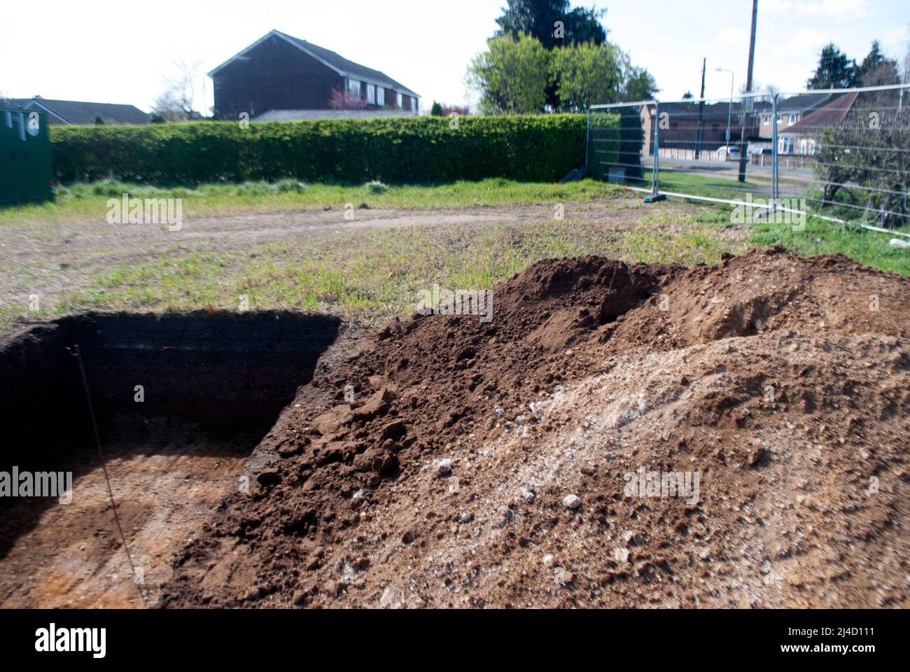 Trenches dug in field for archaeological survey next to village of ...