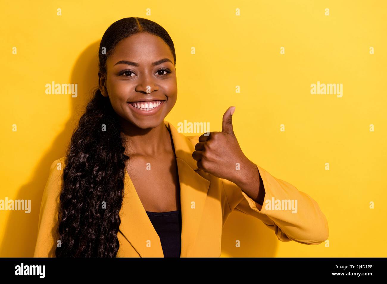 Portrait of attractive cheerful skilled wavy-haired girl expert showing ...