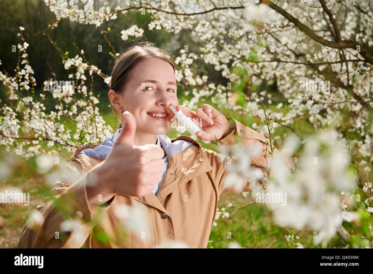Woman allergic suffering from seasonal allergy at spring, posing in ...