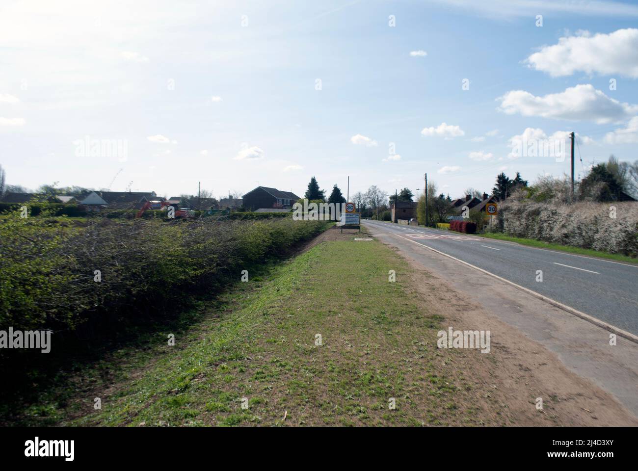 Village name sign for Ruskington and 30 mph speed limit by the side of ...