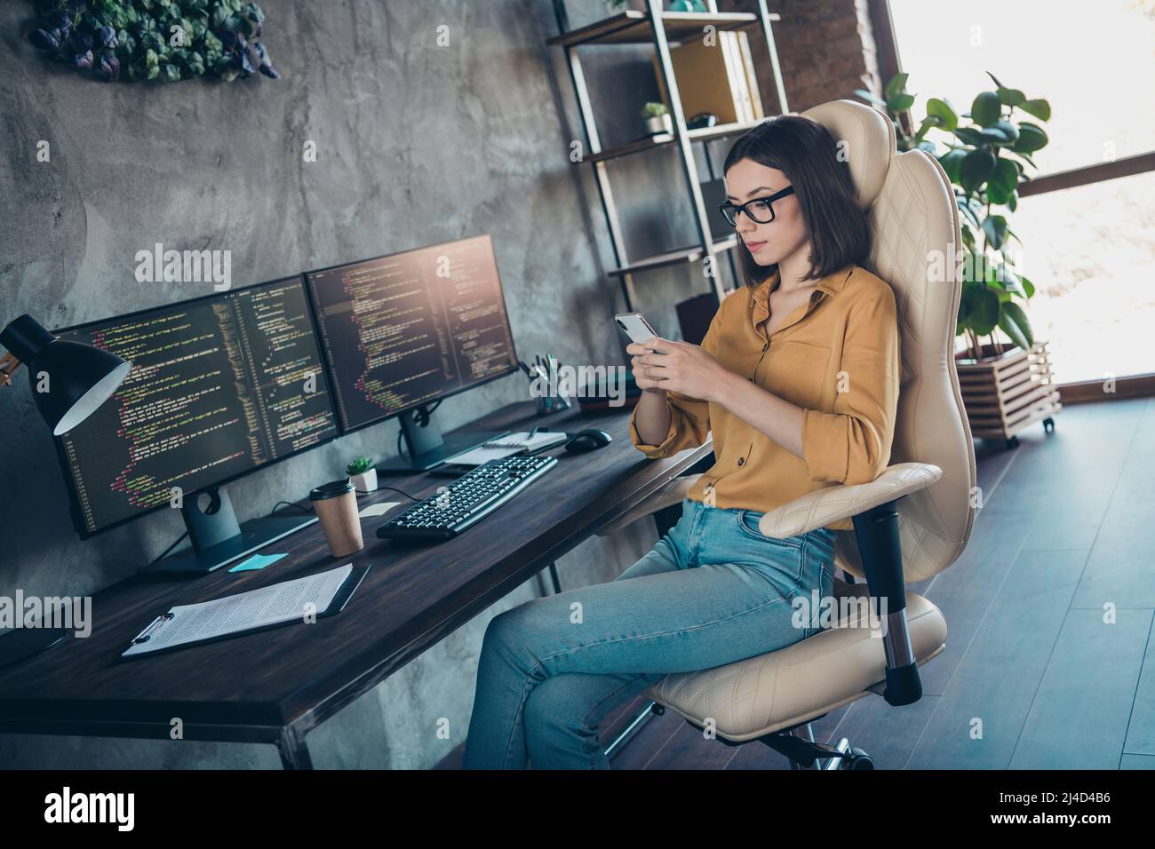 Photo of focused intelligent hardware expert sitting chair use ...