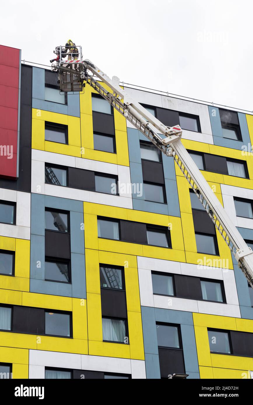Firefighter in lift cage of Essex County Fire & Rescue Service Aerial ...