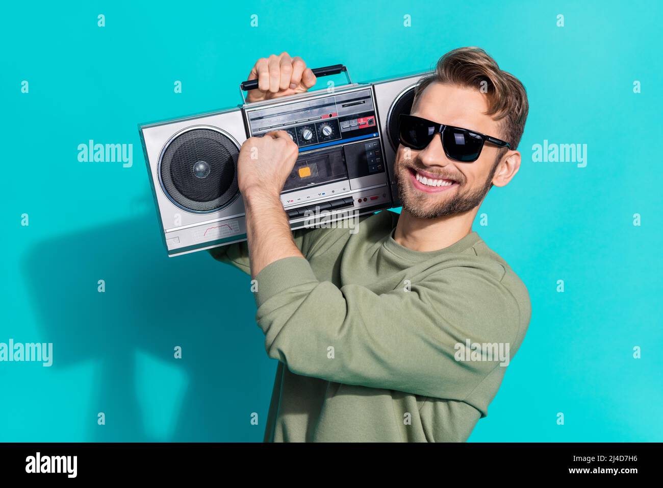 Photo of millennial blond guy hold boombox wear glasses sweater ...