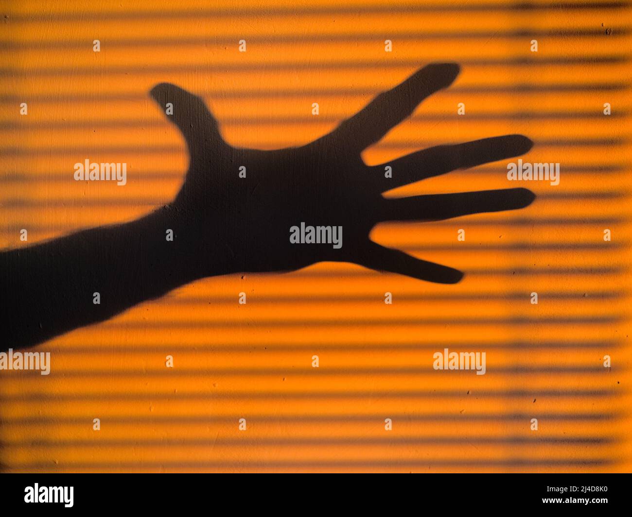 Shadow hand on wall close hi-res stock photography and images - Alamy