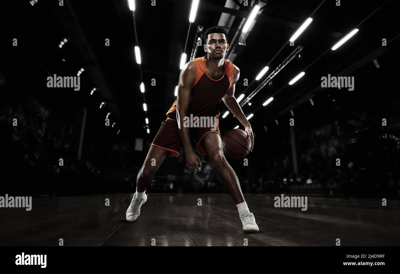 African-american young basketball player in action and motion in ...